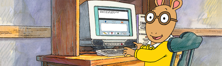 Arthur sitting behind a computer